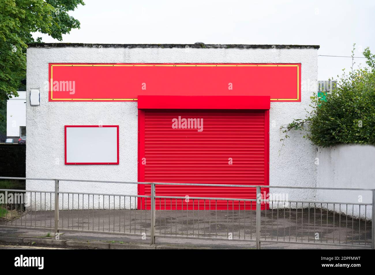 Shop front with blank sign and closed shutter door Stock Photo - Alamy