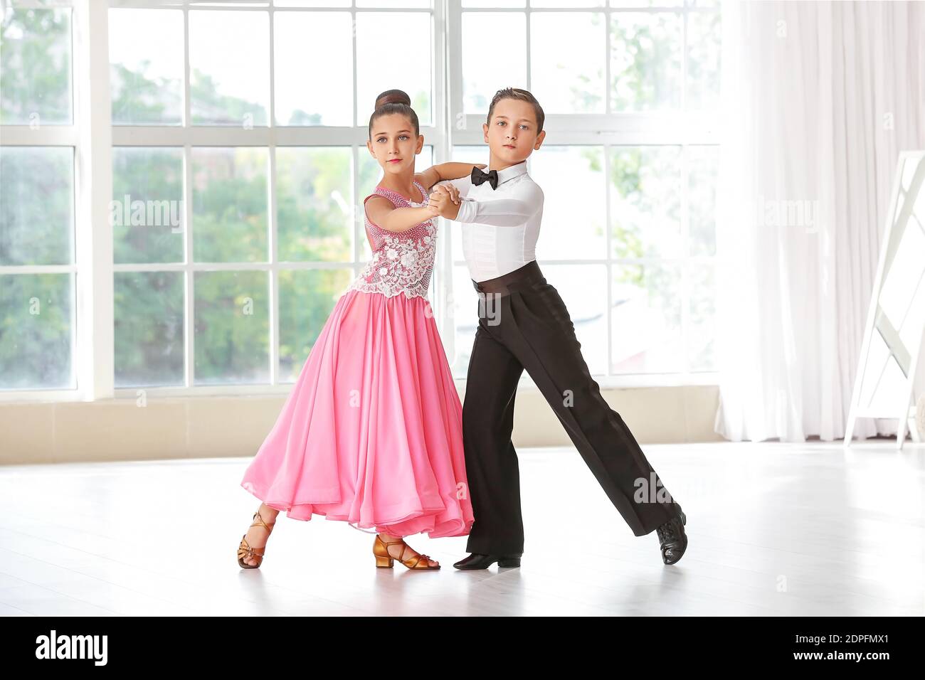 Cute little children dancing in studio Stock Photo - Alamy