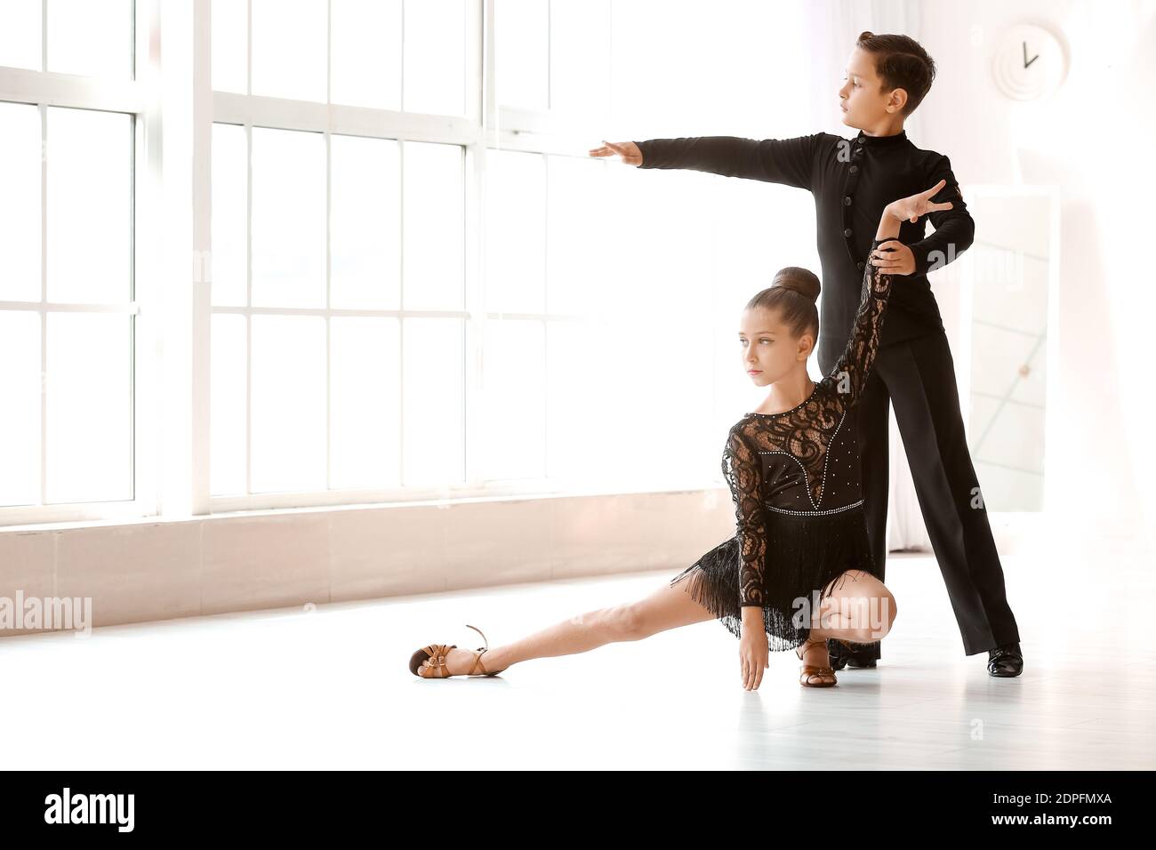 Cute little children dancing in studio Stock Photo - Alamy