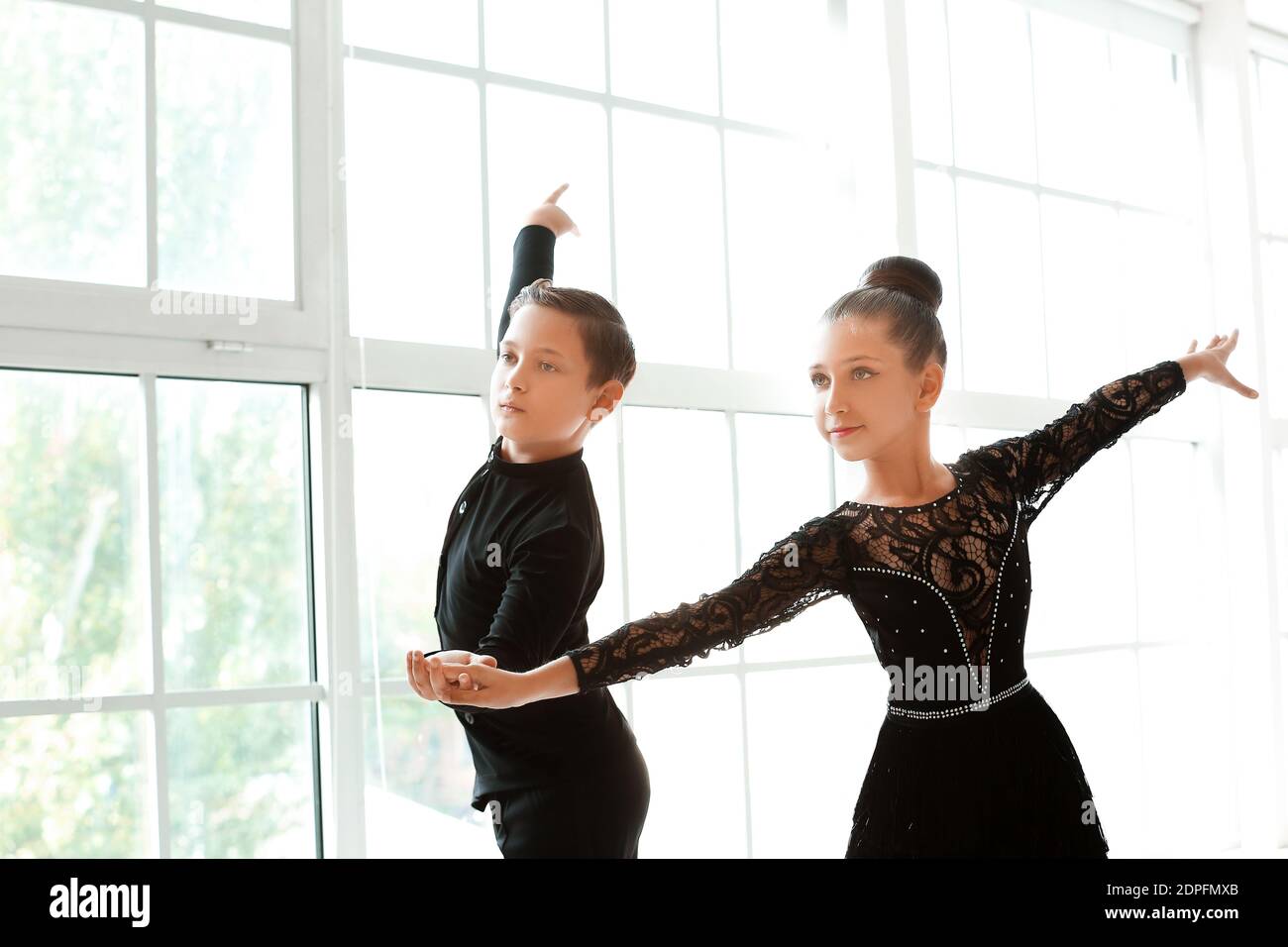 Cute little children dancing in studio Stock Photo - Alamy