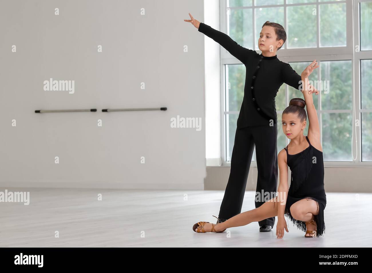 Cute little children dancing in studio Stock Photo - Alamy