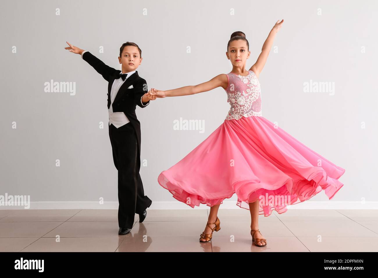 Cute little children dancing in studio Stock Photo - Alamy