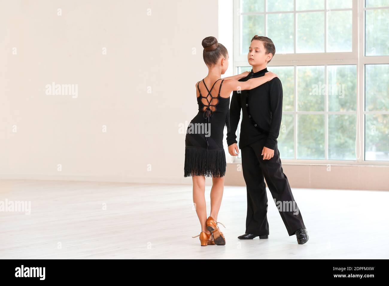Cute little children dancing in studio Stock Photo - Alamy