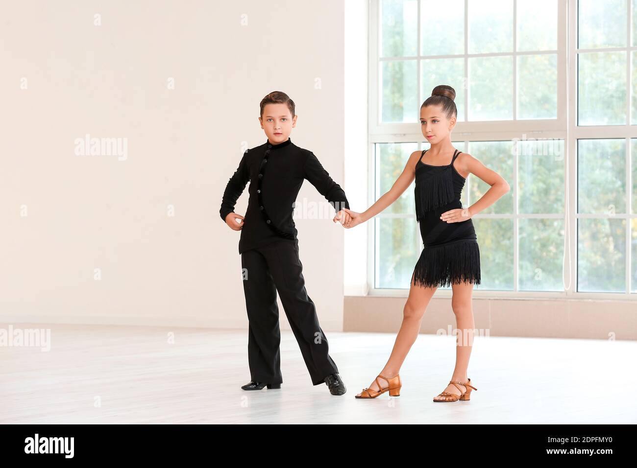 Cute little children dancing in studio Stock Photo - Alamy