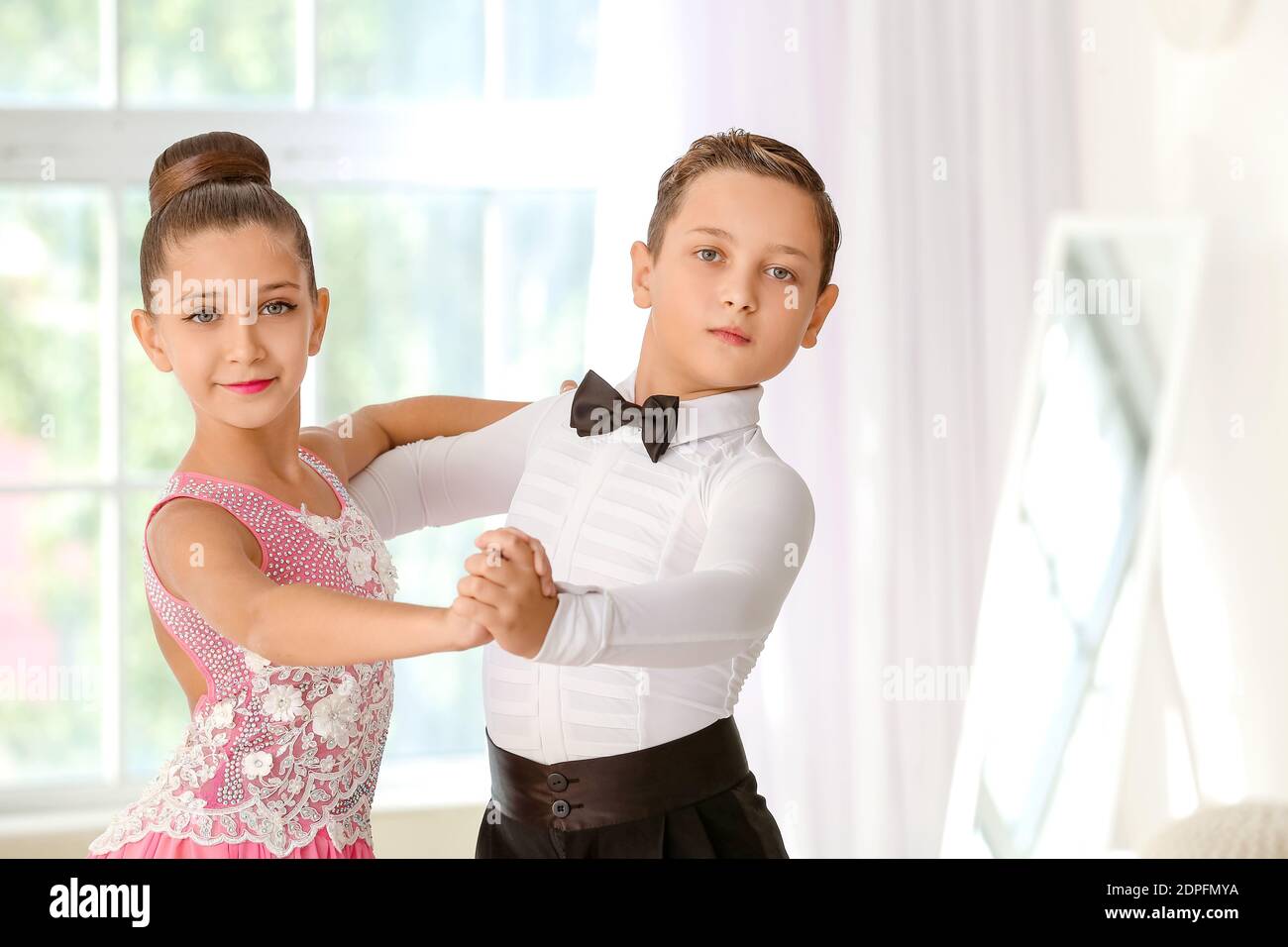 Cute little children dancing in studio Stock Photo - Alamy