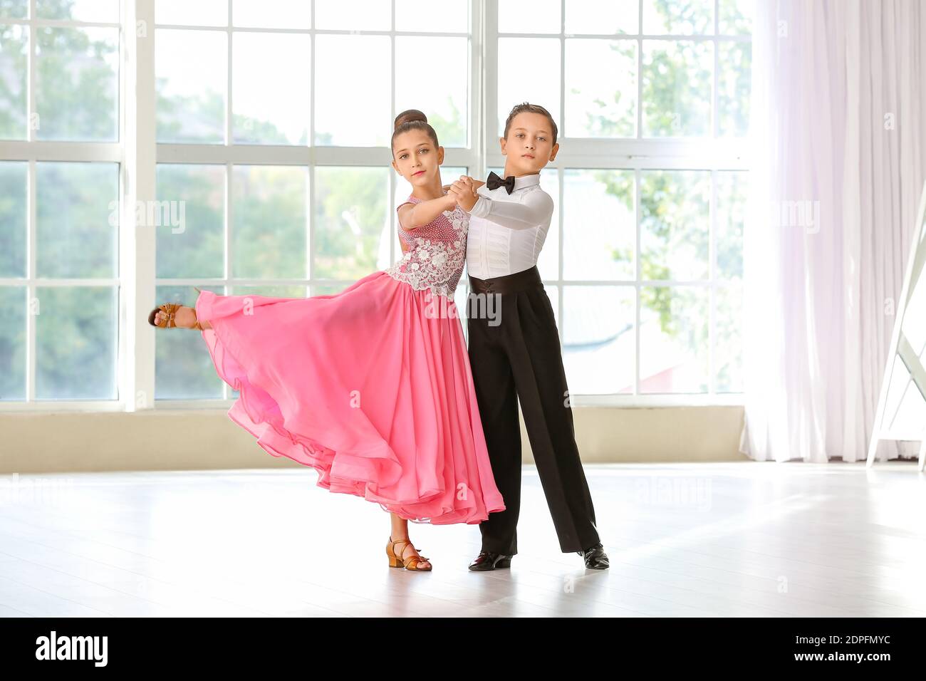 Cute little children dancing in studio Stock Photo - Alamy