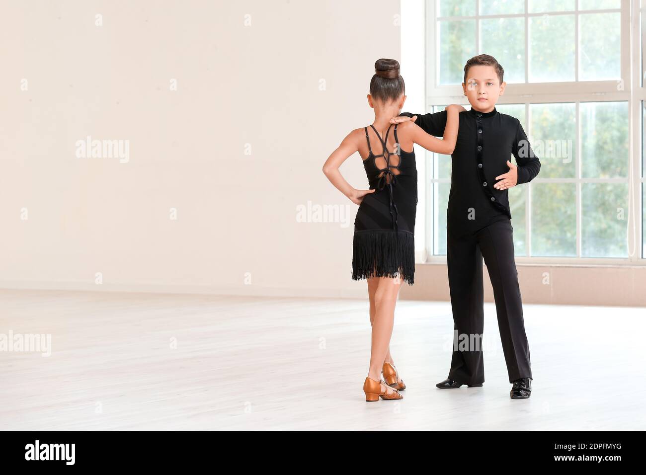 Cute little children dancing in studio Stock Photo - Alamy