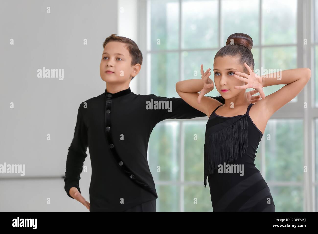 Cute little children dancing in studio Stock Photo - Alamy