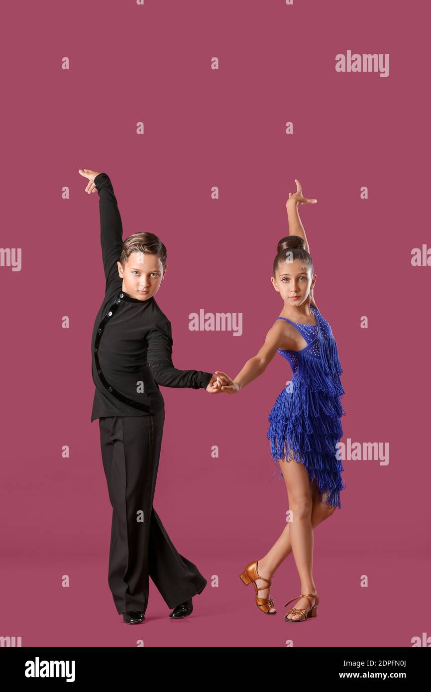 Cute little children dancing against color background Stock Photo - Alamy