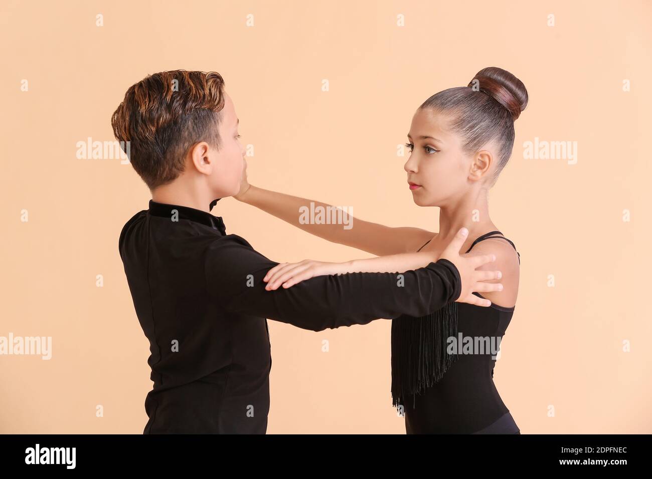 Cute little children dancing against color background Stock Photo - Alamy