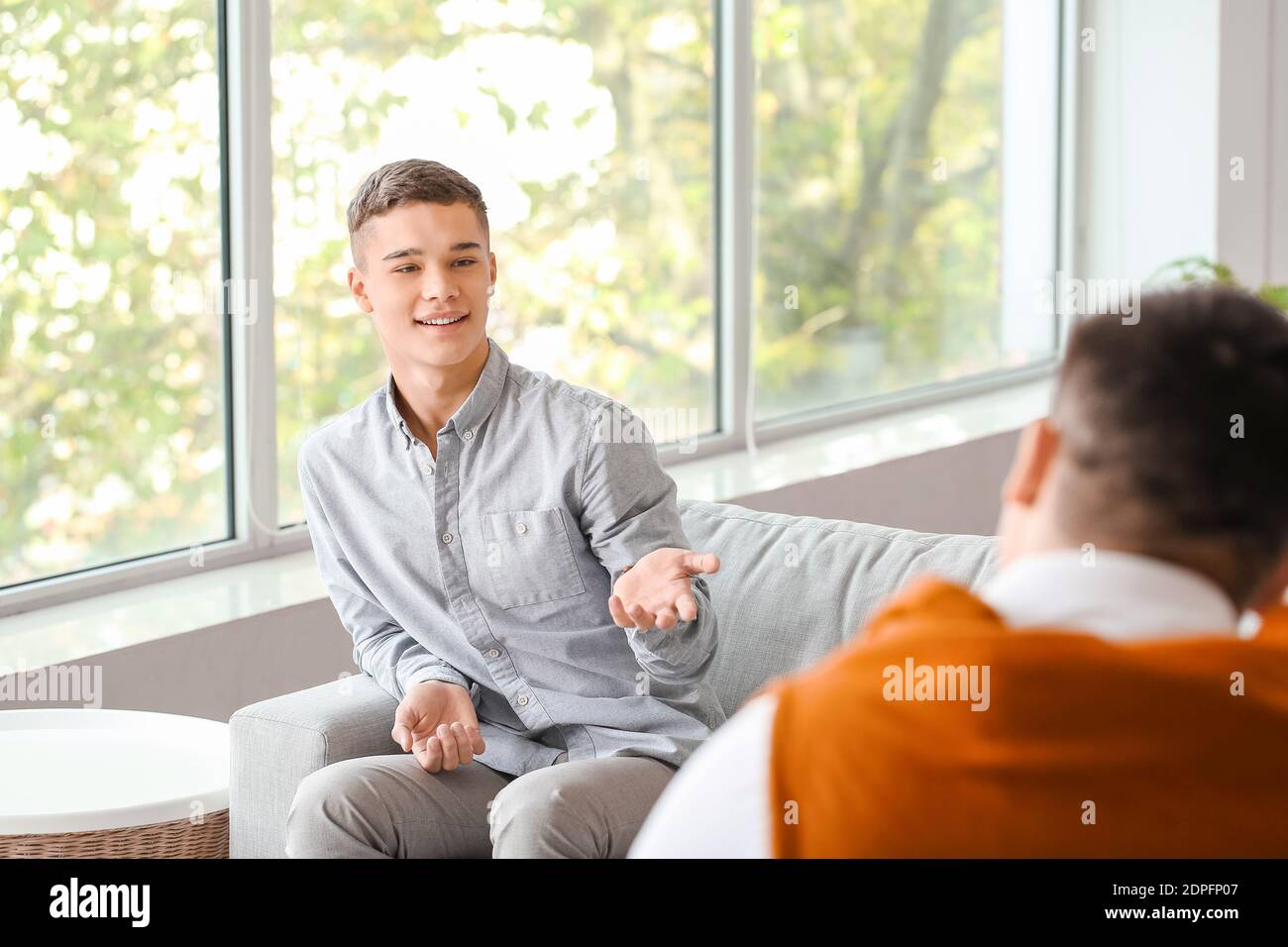 Teenage boy at psychologist's office Stock Photo - Alamy