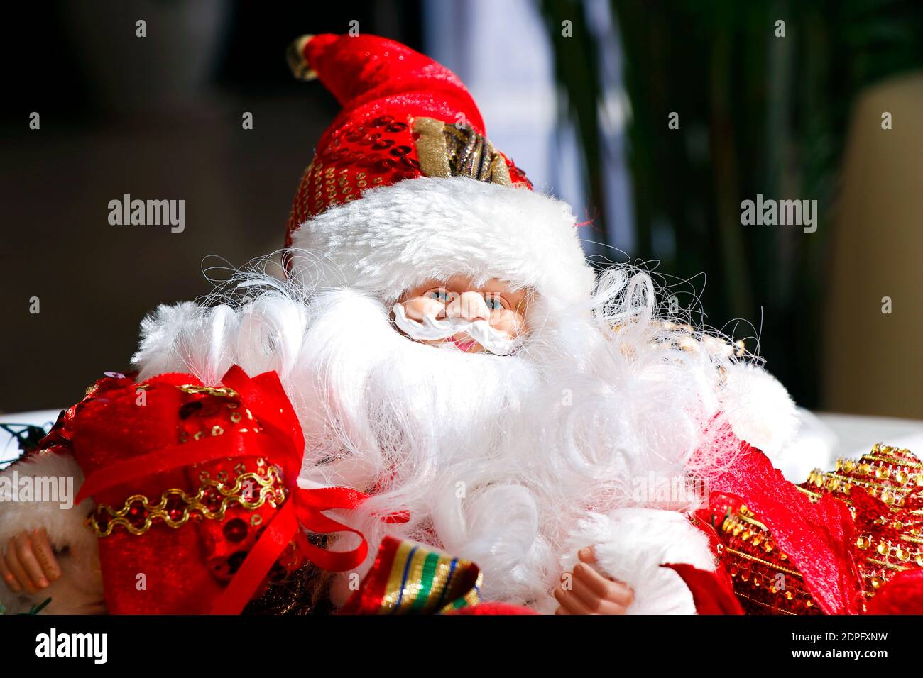 friendly Santa Claus doll face with curly beard, toy santa Stock Photo ...