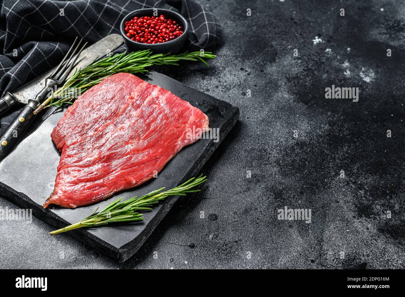 Flat iron steak. Raw Marble beef meat black Angus. Black background ...