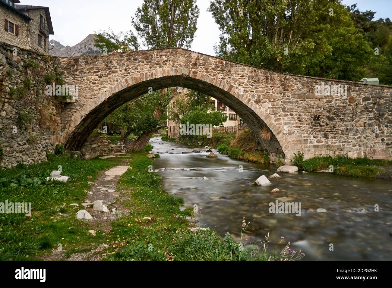Roman bridge over river of rapid water Stock Photo - Alamy