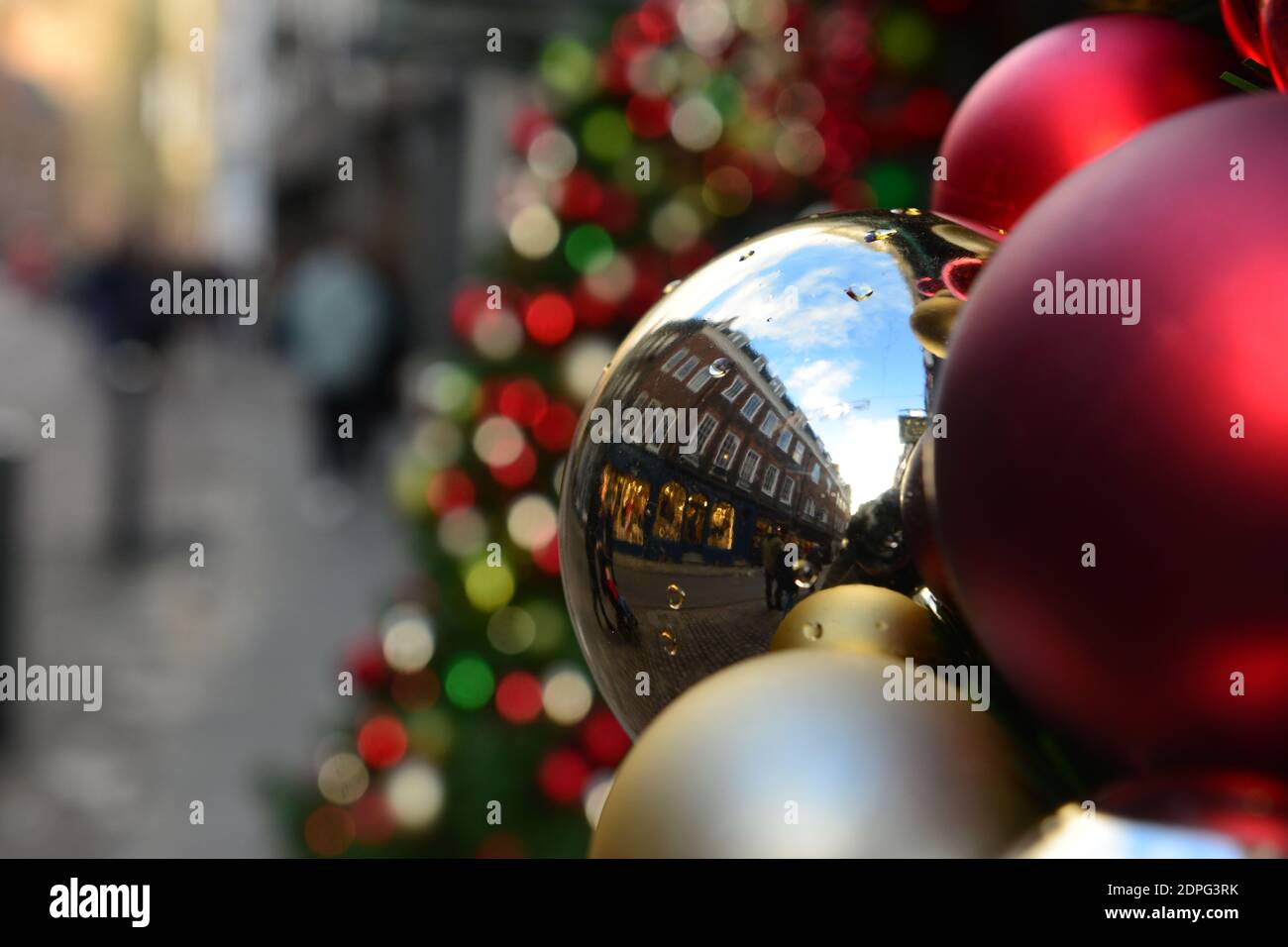 Cambridge, UK, 19-12-2020, Christmas tree bauble reflecting street ...