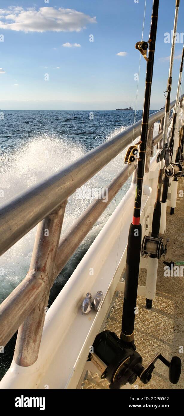 Fishing boat with rods set for deep water fishing – Gulf of Mexico ...