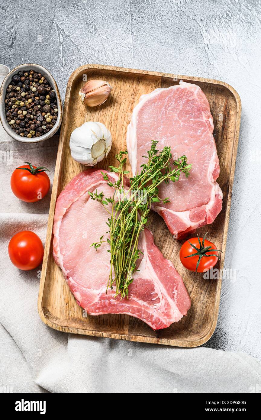 Raw pork cutlet. Organic meat steak. White background. Top view Stock ...
