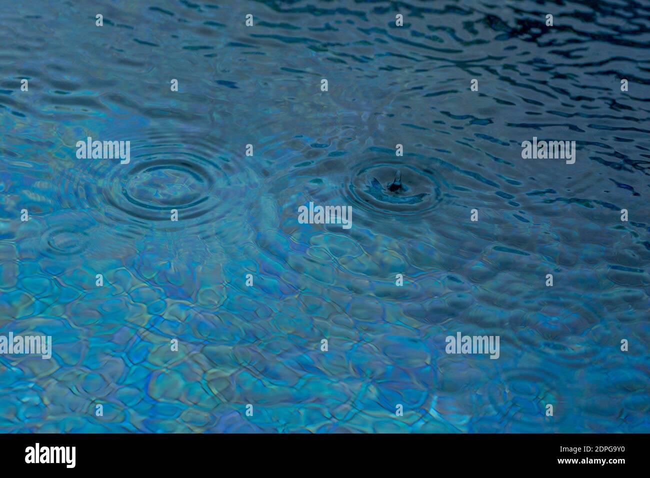 Circle water ripple wave surface background. Rain drop on swimming pool ...