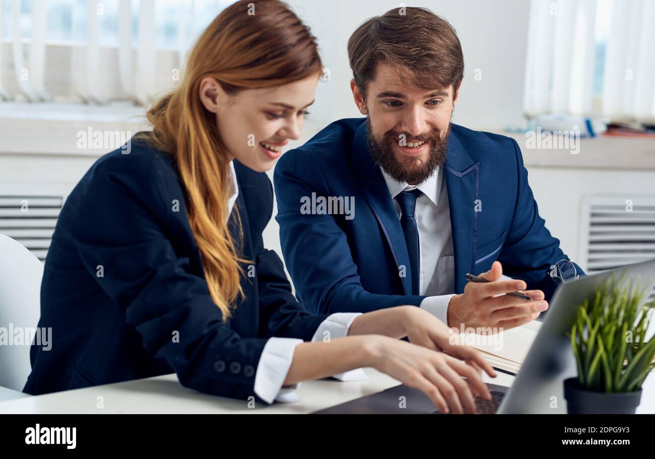 Business people at the table with laptop emotions model manager ...