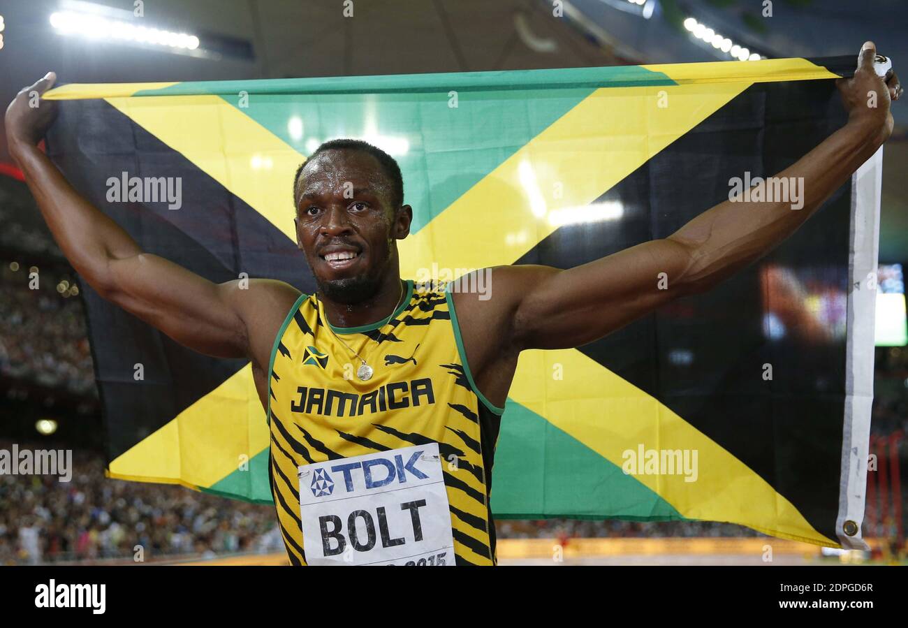 Usain bolt with flag hi-res stock photography and images - Alamy