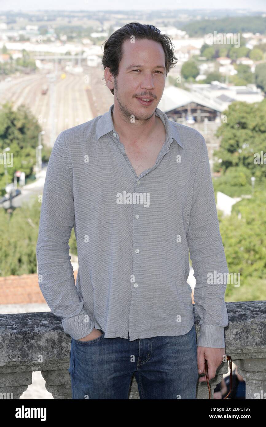 Reda Kateb poses for the photocall of 'Arretez-moi la' during the 8th ...