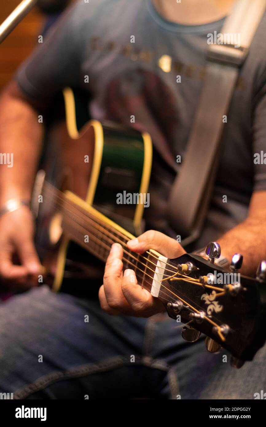 close up view of the hands of a guitarist playing guitar Stock Photo ...