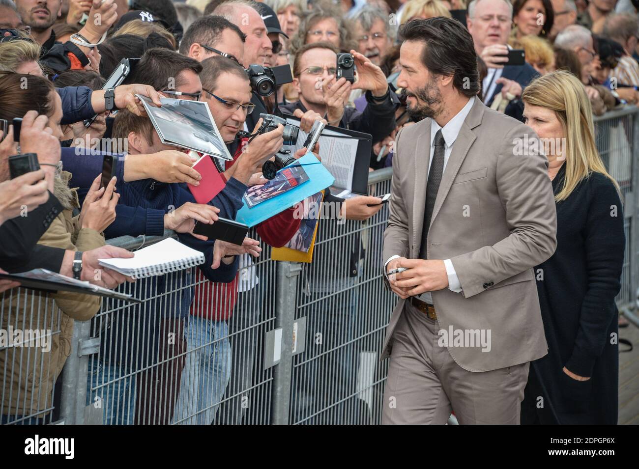Keanu Reeves poses outside the beach cabin named after him as part of a ...