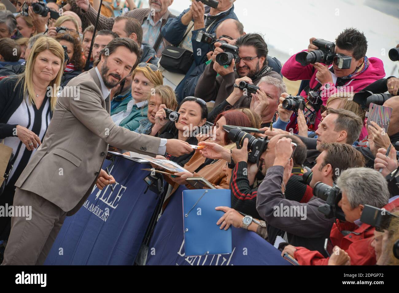 Keanu Reeves poses outside the beach cabin named after him as part of a ...