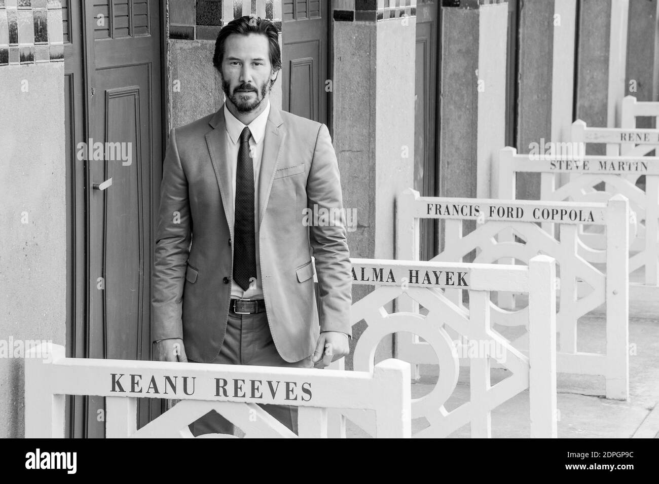 Keanu Reeves poses outside the beach cabin named after him as part of a ...