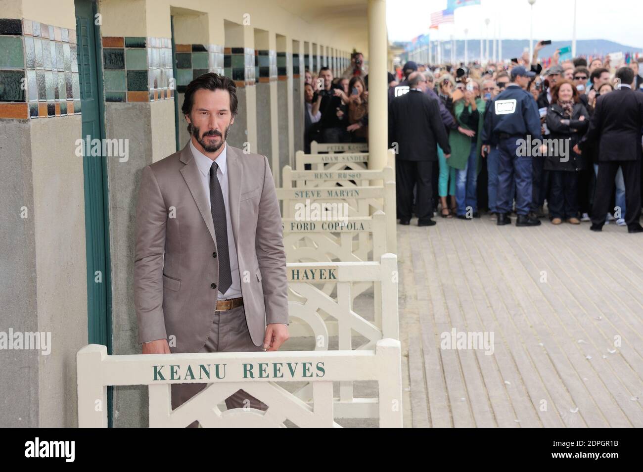 Keanu Reeves poses outside the beach cabin named after him as part of a ...