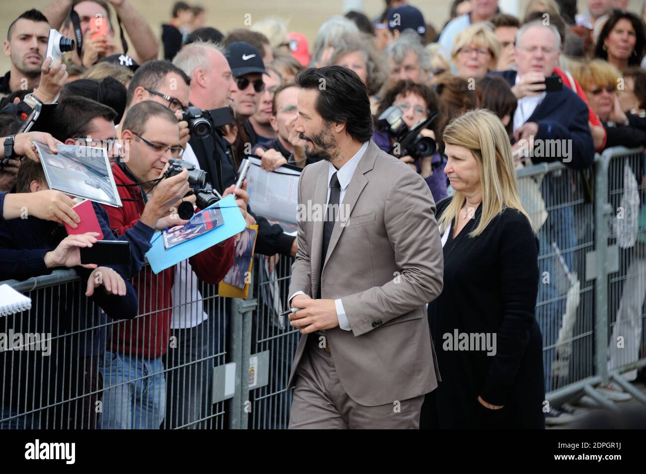 Keanu Reeves poses outside the beach cabin named after him as part of a ...