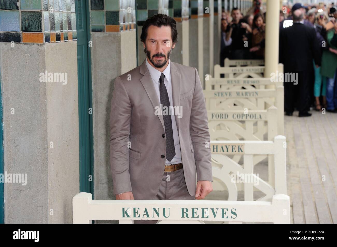 Keanu Reeves poses outside the beach cabin named after him as part of a ...