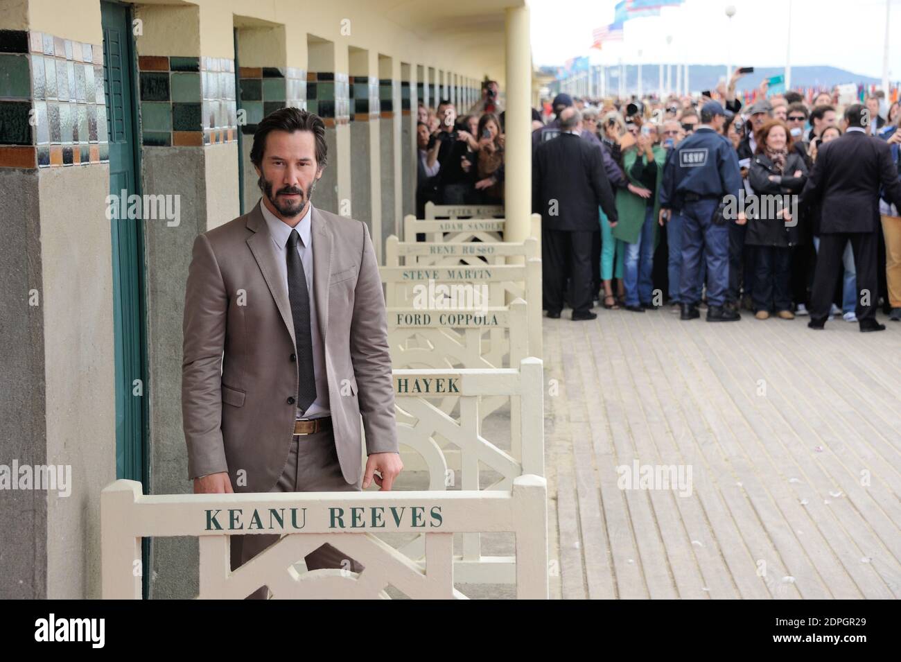 Keanu Reeves poses outside the beach cabin named after him as part of a ...
