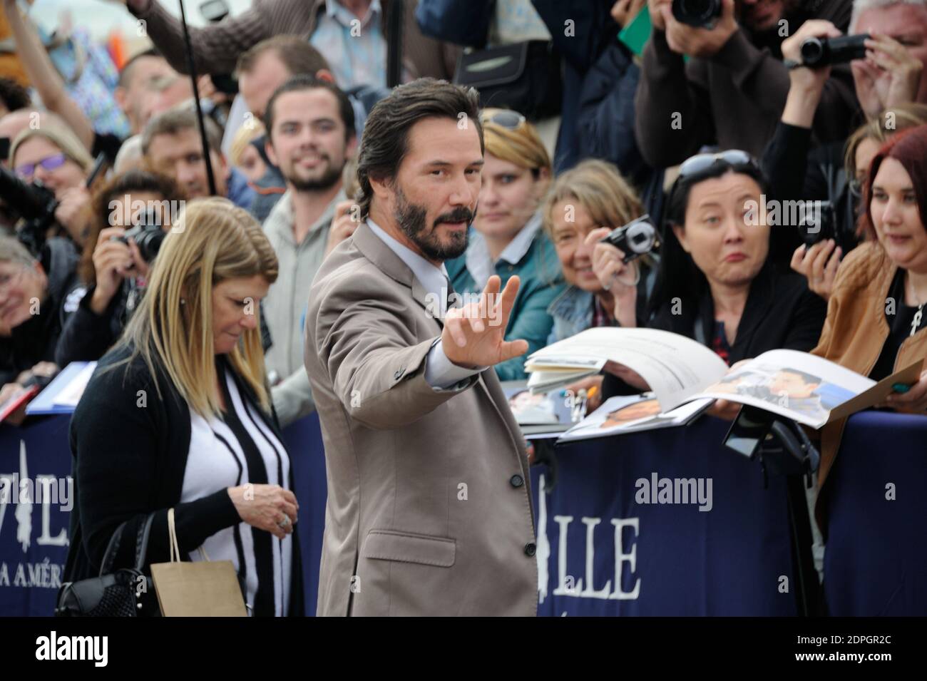 Keanu Reeves poses outside the beach cabin named after him as part of a ...