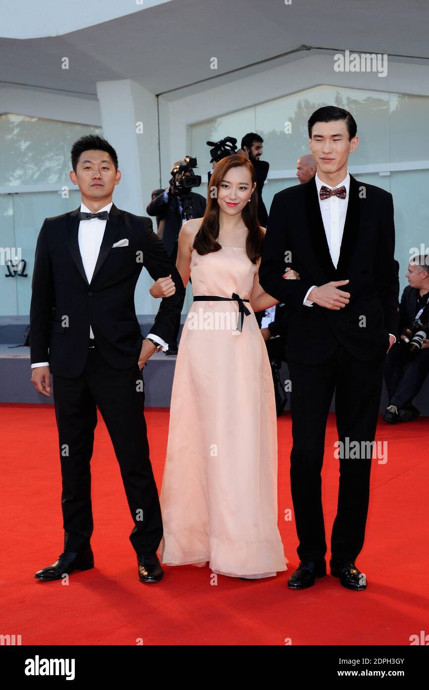 Director Peng Fei (L), actors Ying Ze (C) and Luo Wenjie attend the ...