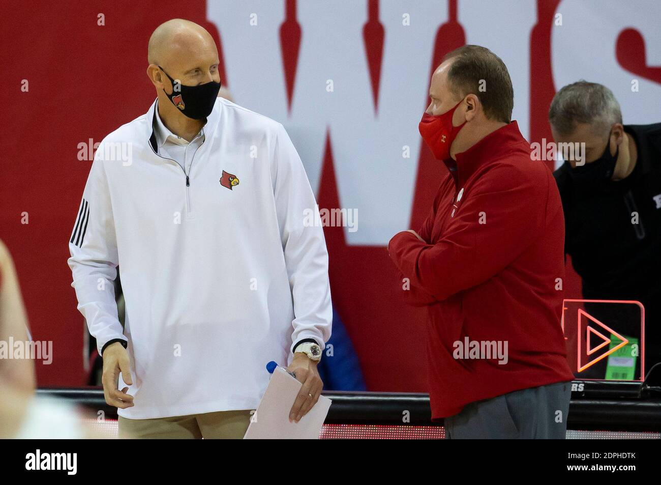 Madison, WI, USA. 19th Dec, 2020. Head coaches meet after the game ...