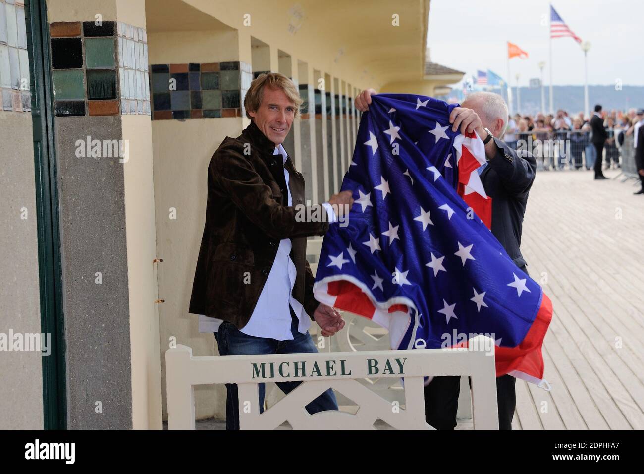 Michael Bay posing next to the beach closet dedicated to his on the ...
