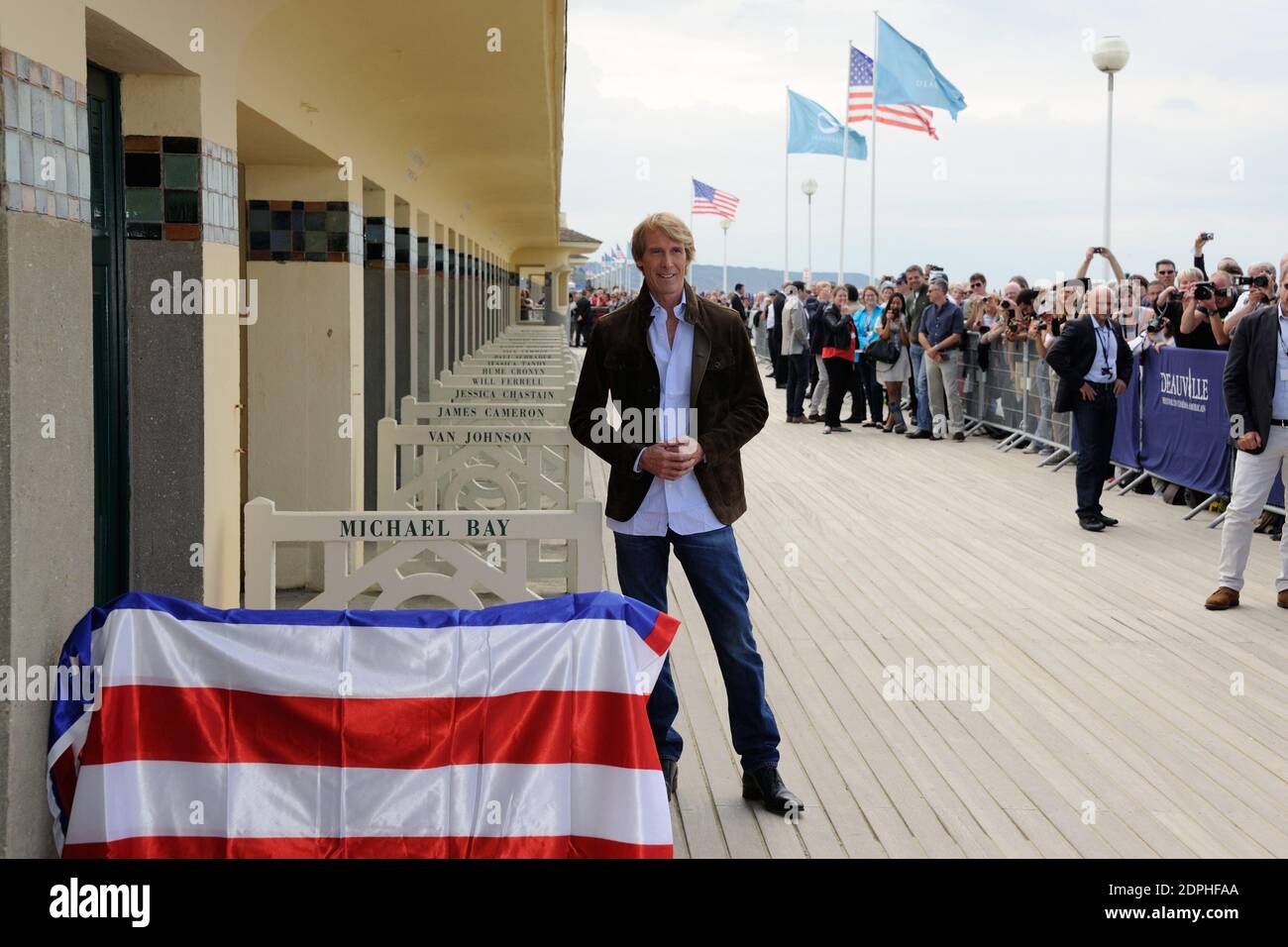 Michael Bay posing next to the beach closet dedicated to his on the ...