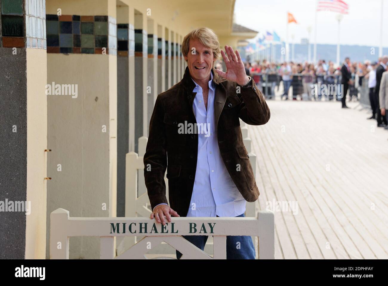 Michael Bay posing next to the beach closet dedicated to his on the ...