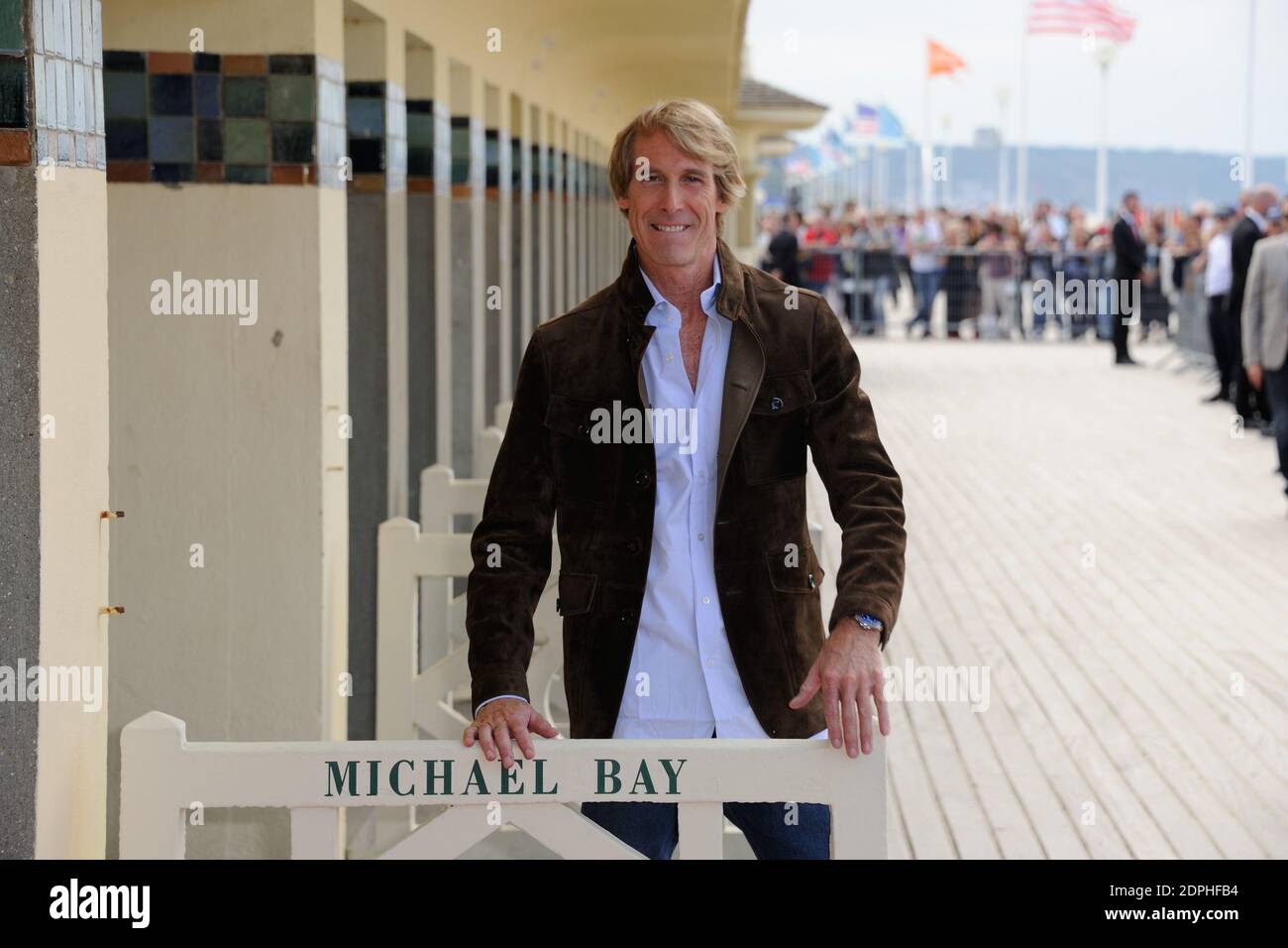 Michael Bay posing next to the beach closet dedicated to his on the ...