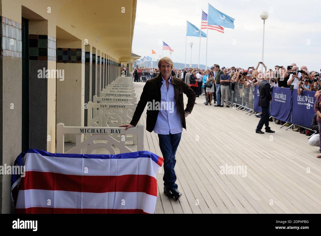 Michael Bay posing next to the beach closet dedicated to his on the ...