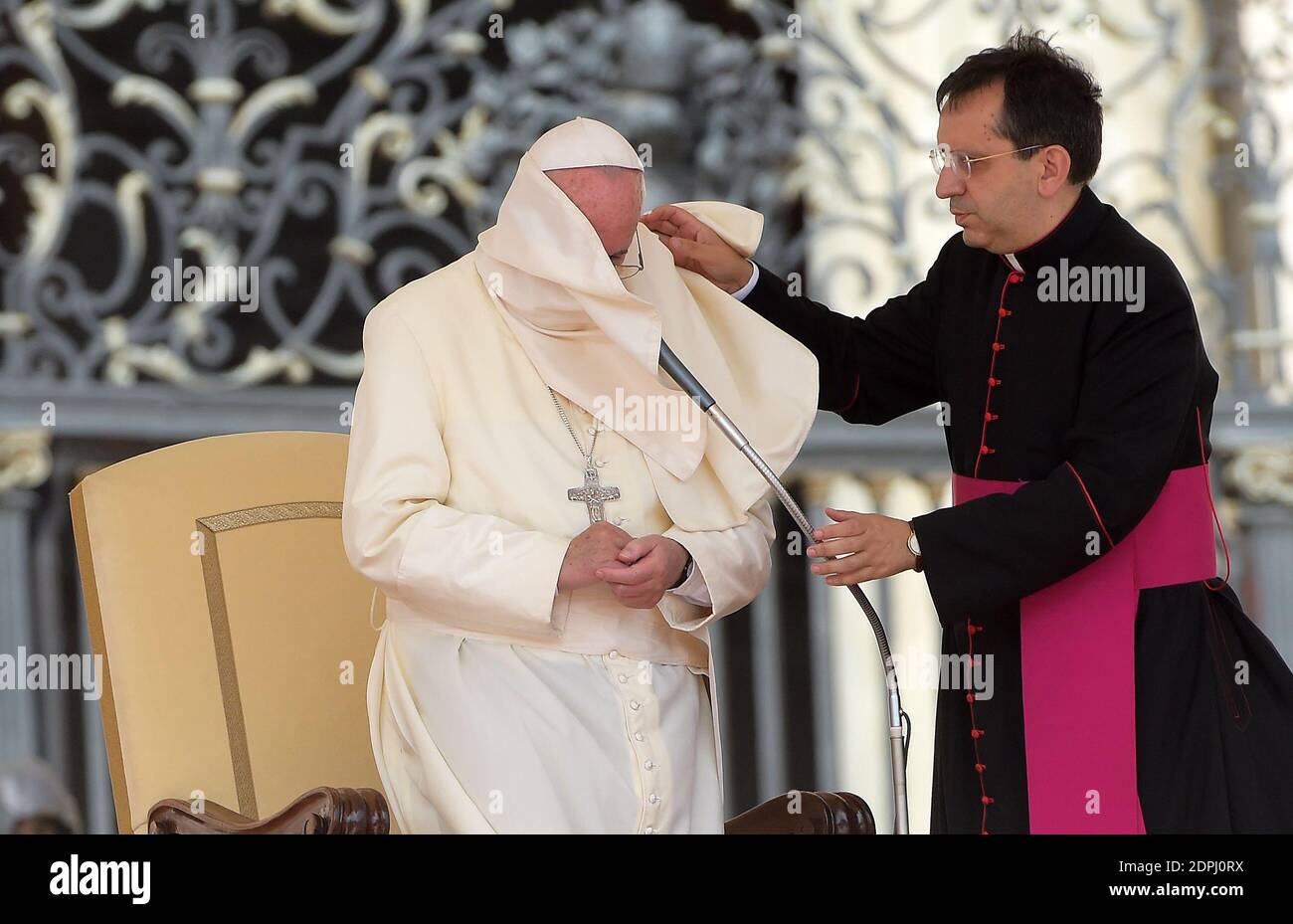 The wind blows the dress of Pope Francis as he leads his weekly general ...