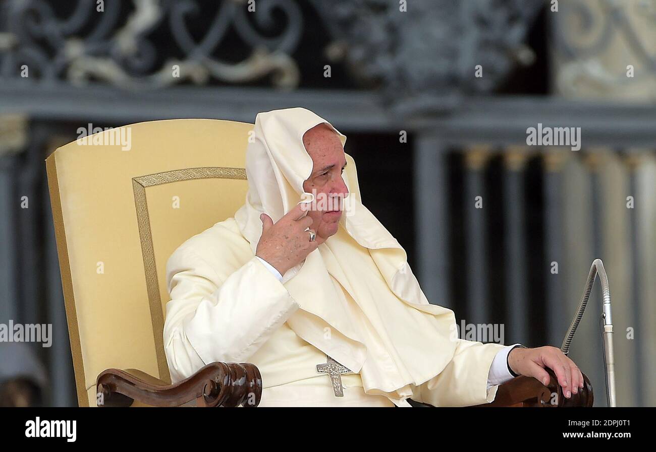 The wind blows the dress of Pope Francis as he leads his weekly general ...