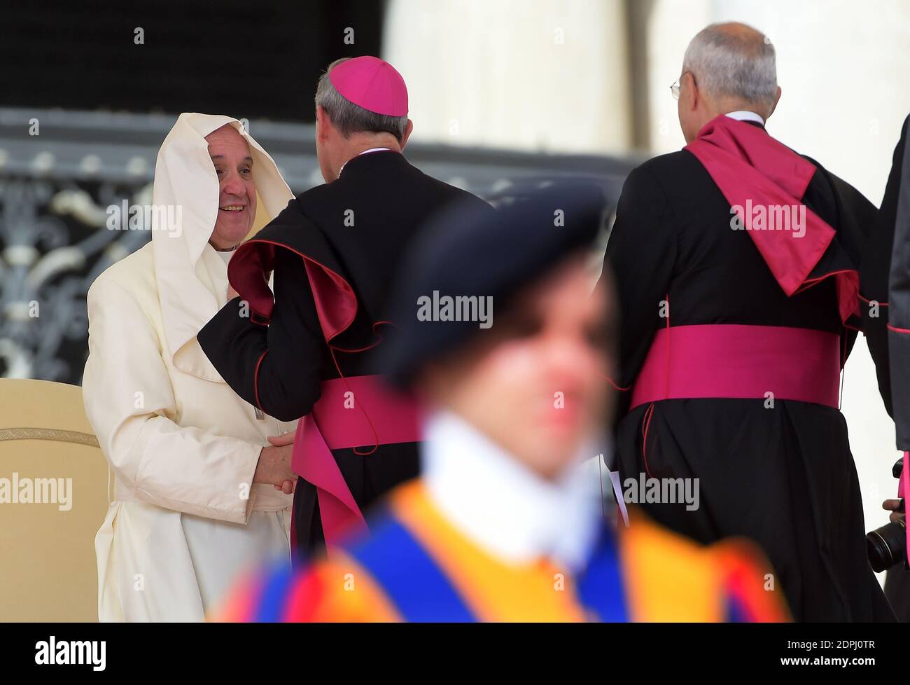The wind blows the dress of Pope Francis as he leads his weekly general ...