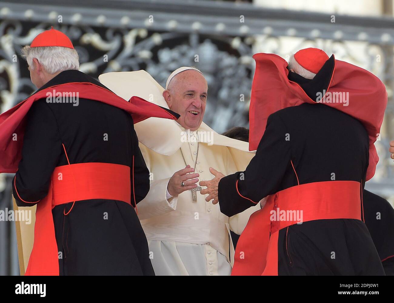 The wind blows the dress of Pope Francis as he leads his weekly general ...