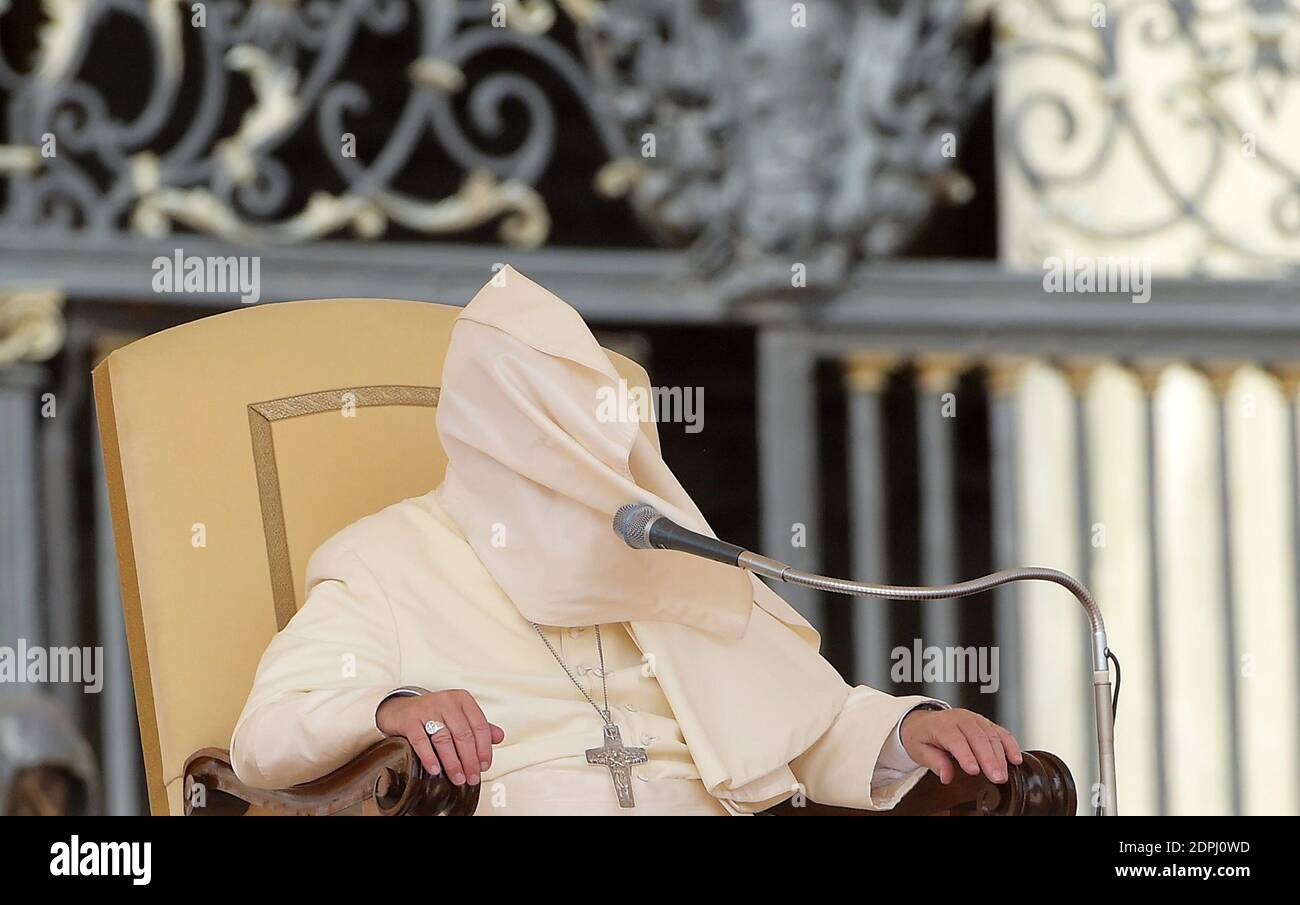 The wind blows the dress of Pope Francis as he leads his weekly general ...