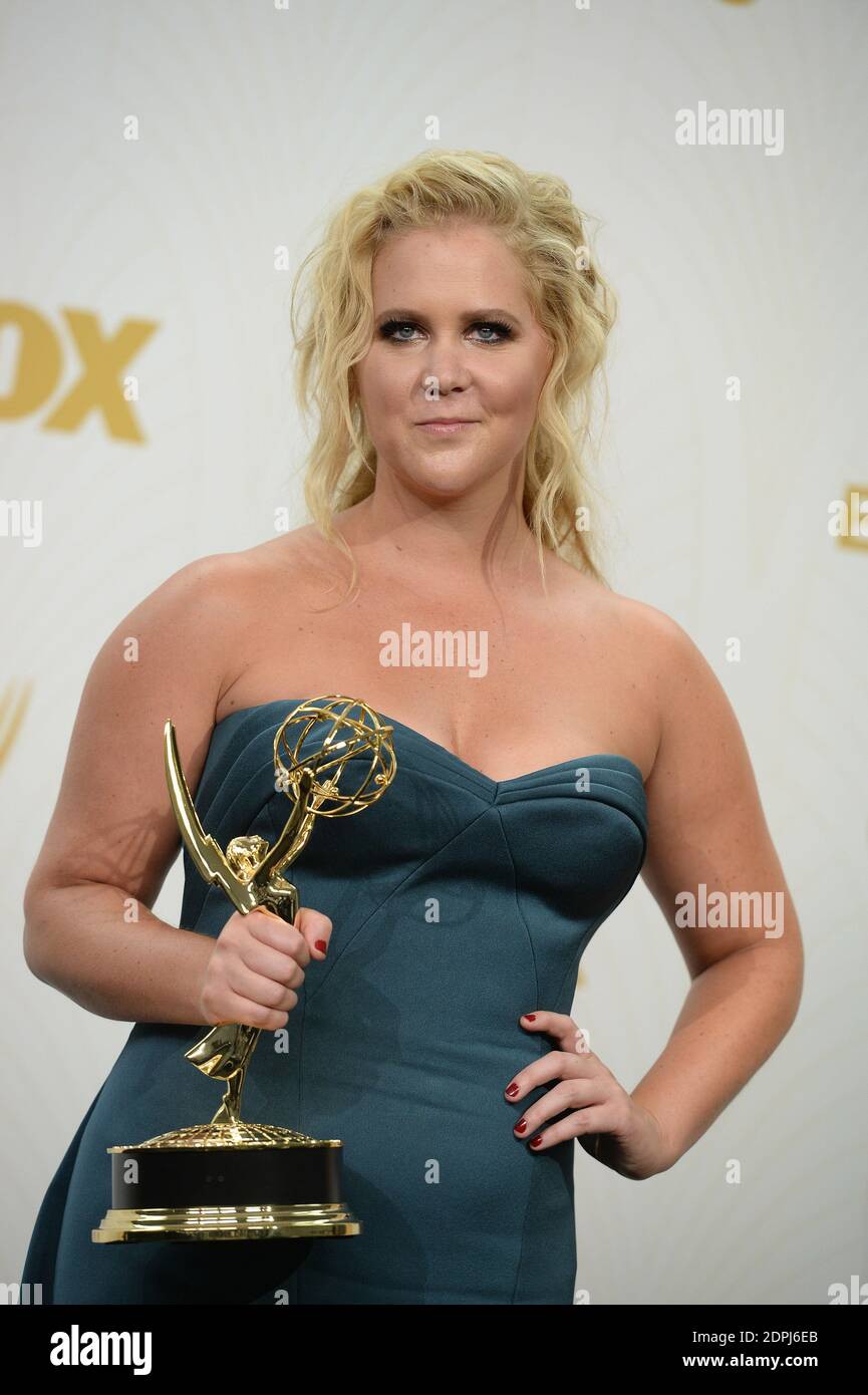 Amy Schumer poses in the press room of the 67th Emmy Awards at the ...