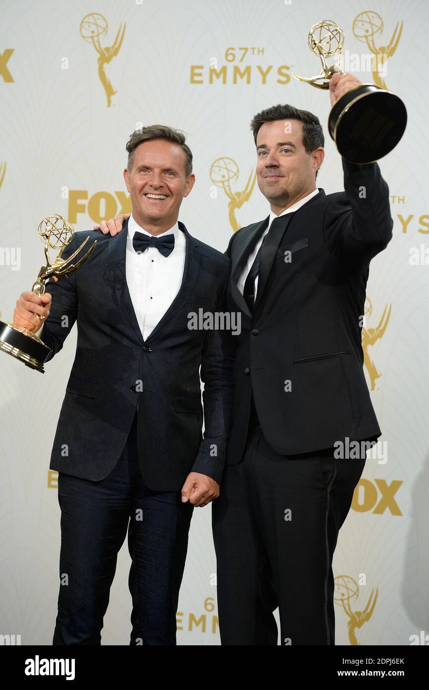 Carson Daly and Mark Burnett pose in the press room of the 67th Emmy ...