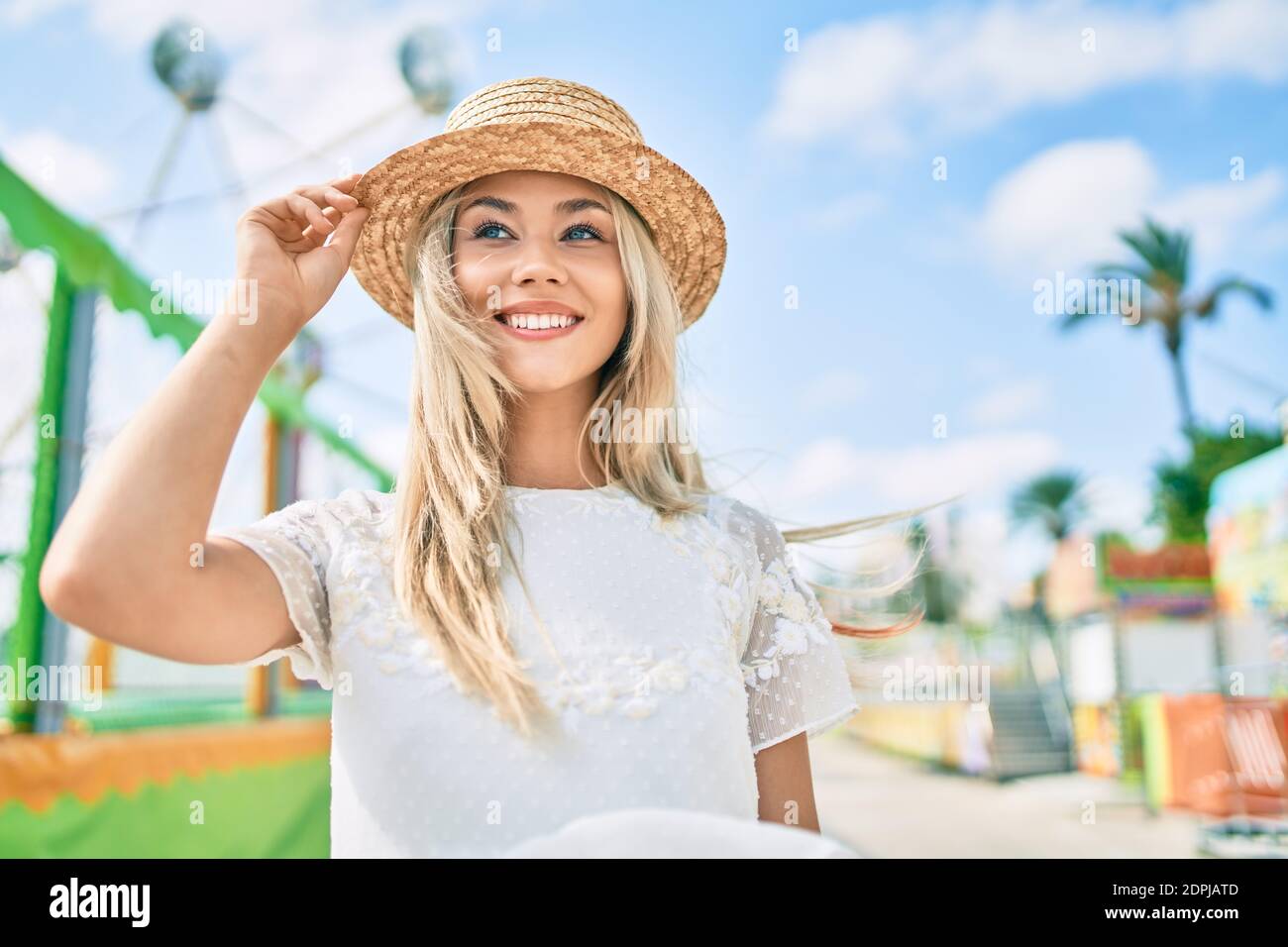 Young caucasian tourist girl smiling happy walking at fairground Stock ...
