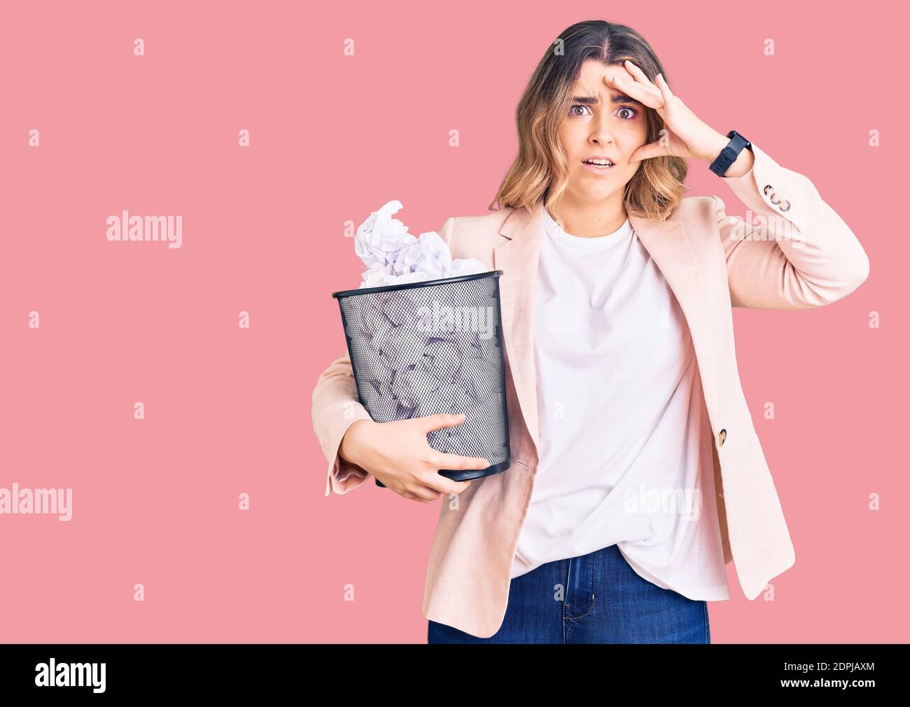 Woman holding papers shocked hi-res stock photography and images - Alamy